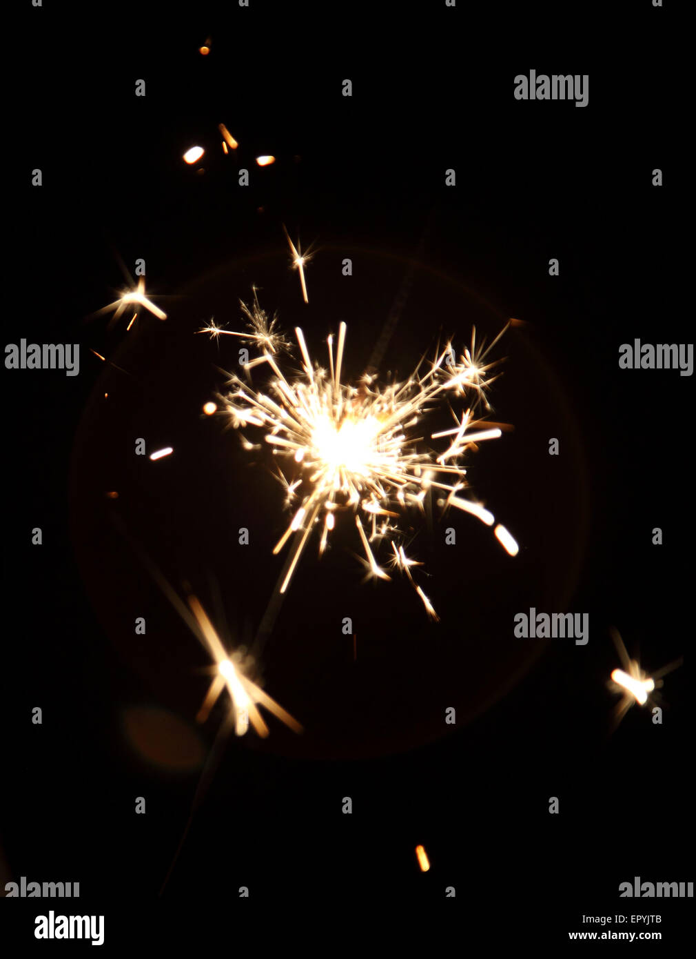 burning sparkler on a dark background Stock Photo - Alamy