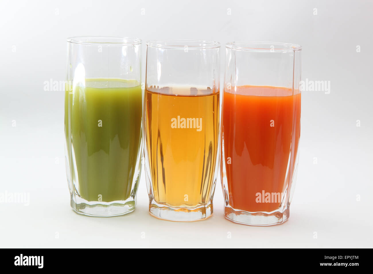 three glasses with juice Stock Photo - Alamy