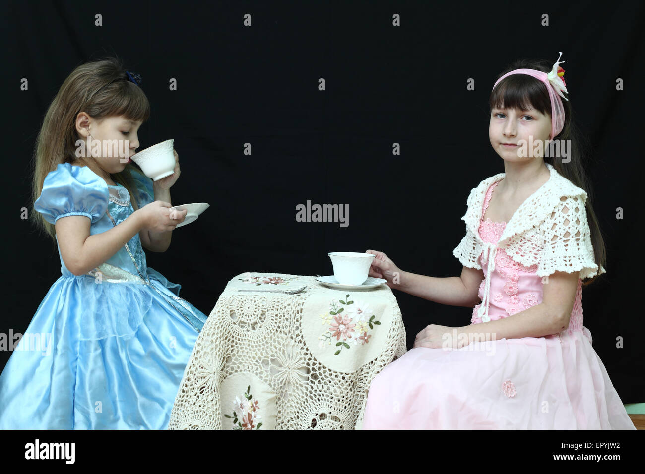 Two children having tea party hi-res stock photography and images - Alamy