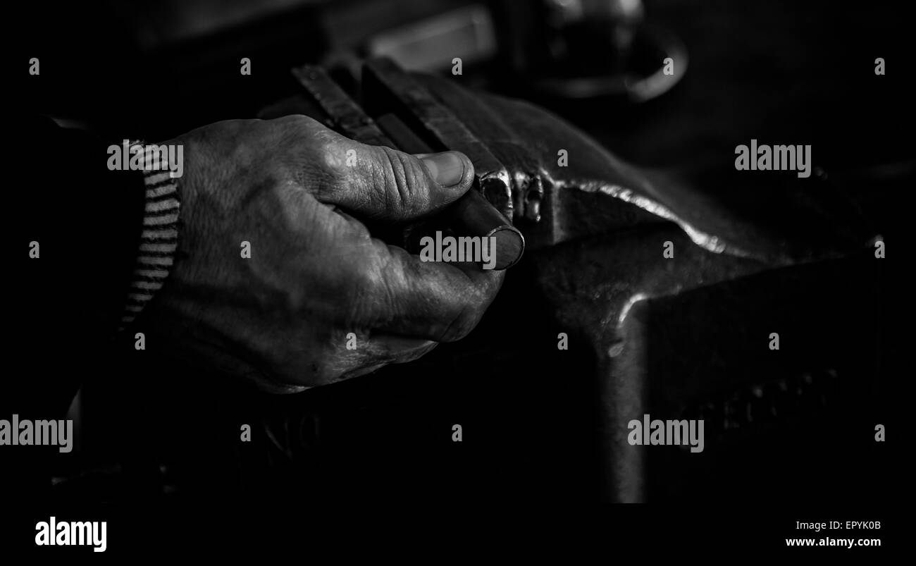 Black and White image of the Hand of a Man Working with a Vice Stock ...
