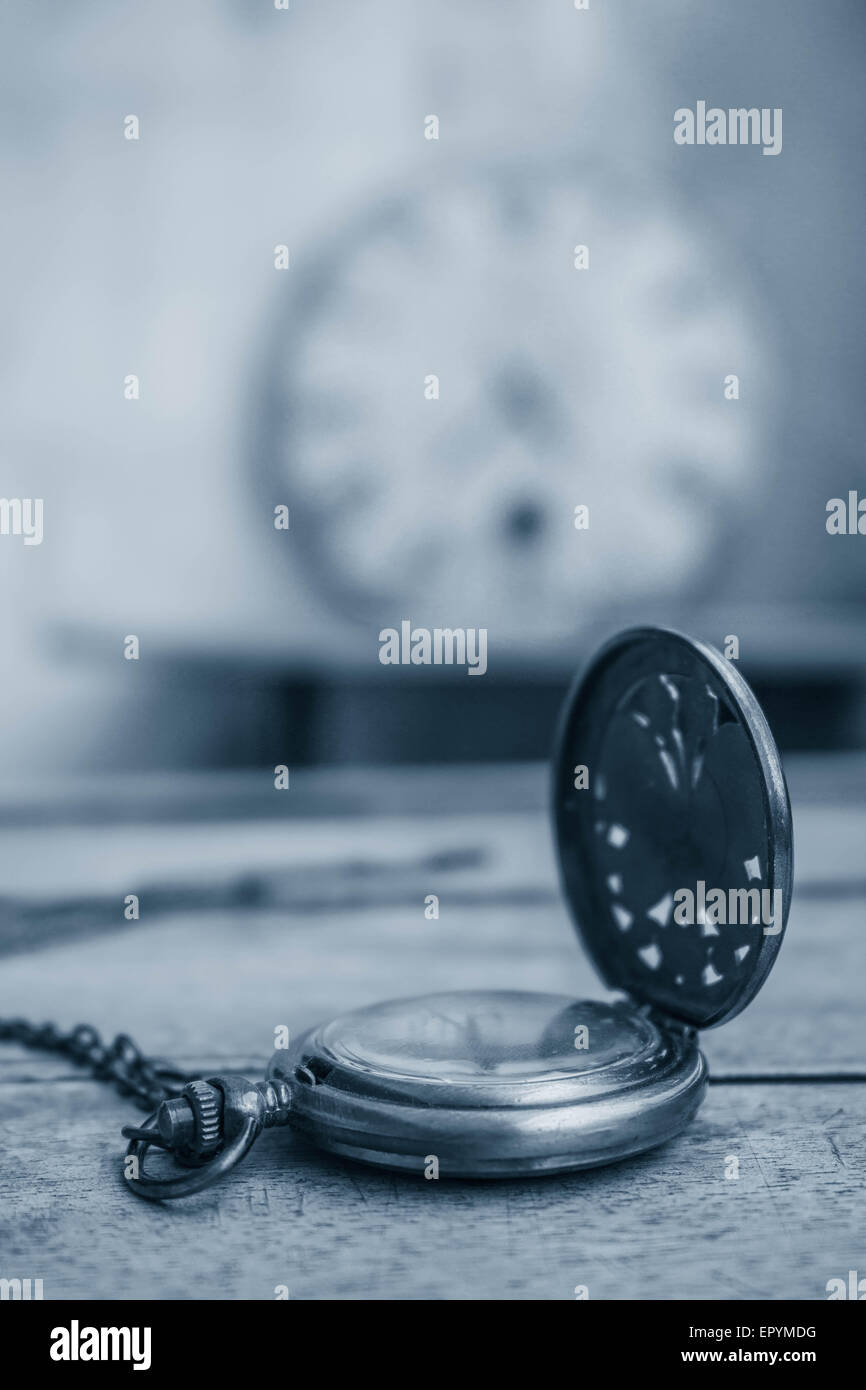 Classic antique clock on the old wooden Stock Photo - Alamy