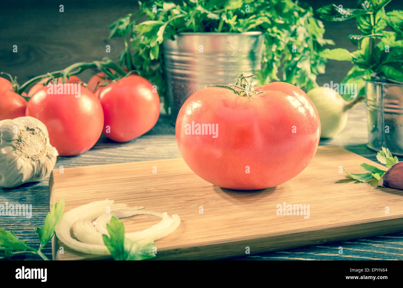 Fresh tomato and vegetables arranged on a wooden table Stock Photo - Alamy