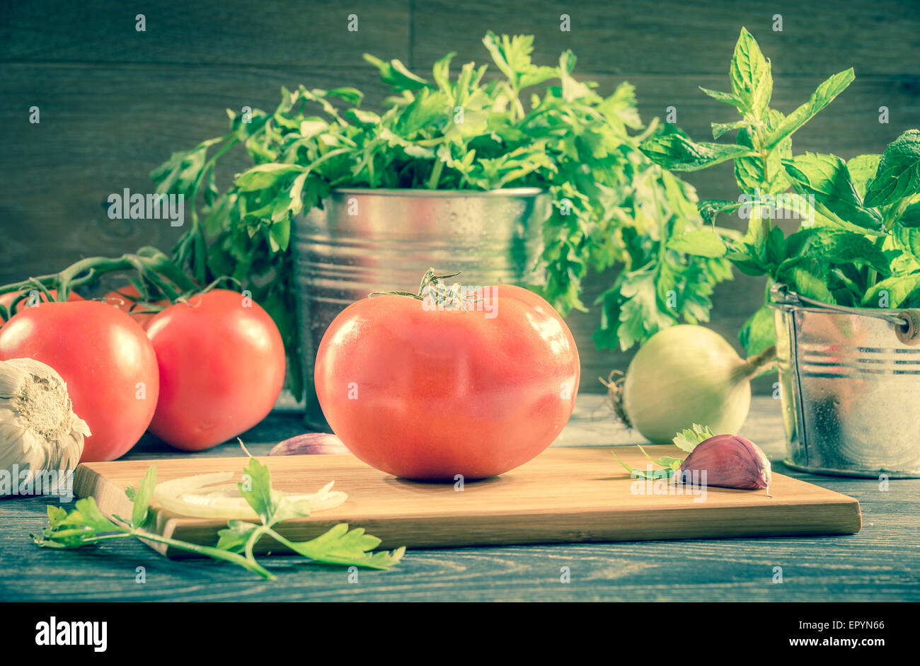 Fresh tomato and vegetables arranged on a wooden table Stock Photo - Alamy