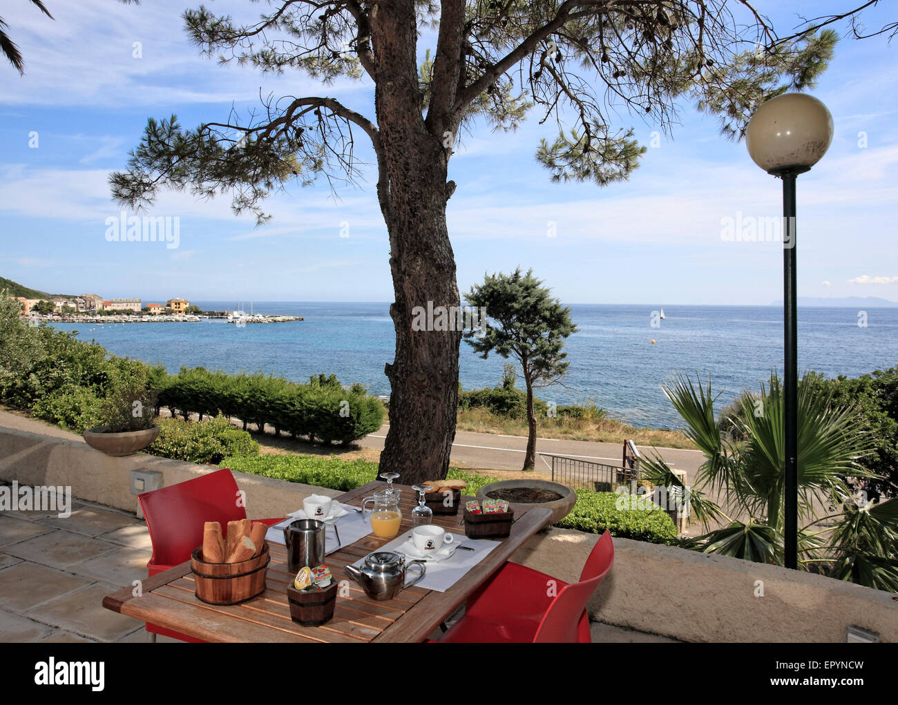 table ready for breakfast on the sea in corsica Stock Photo - Alamy