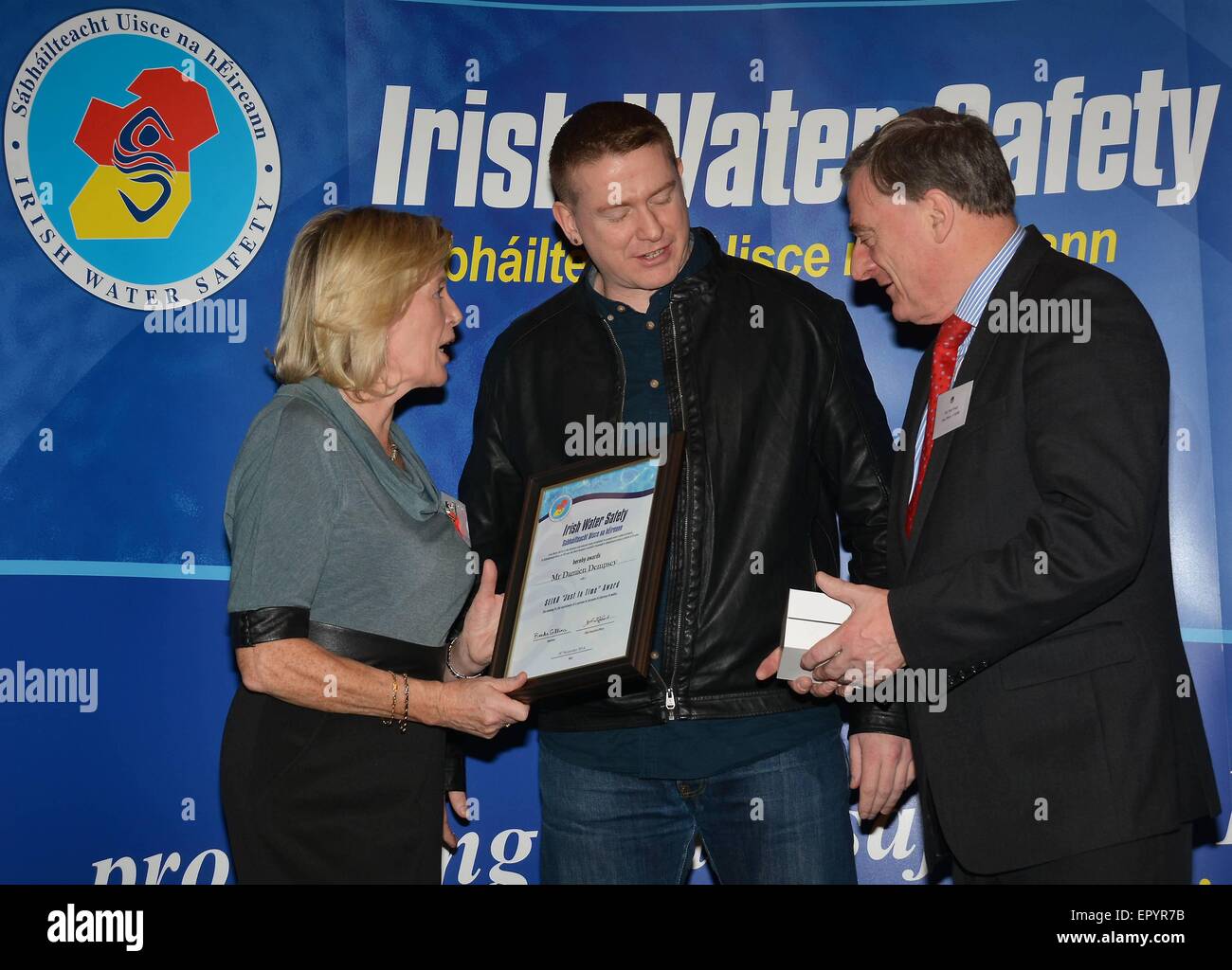 Irish singer Damien Dempsey receives an award from Irish Water Safety ...
