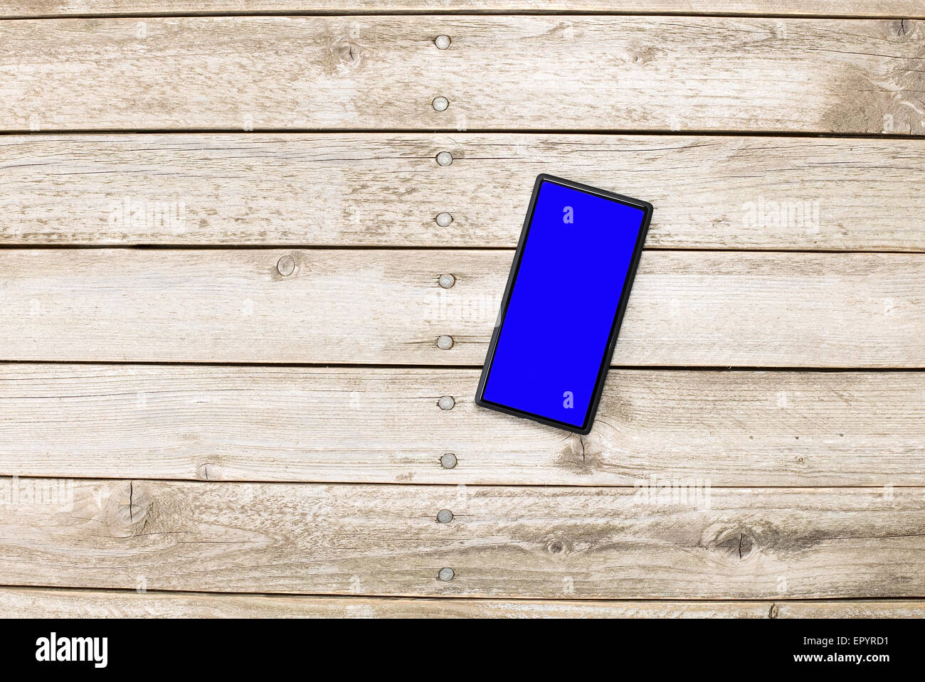 Mobile phone placed on wooden floor with nature background Stock Photo ...