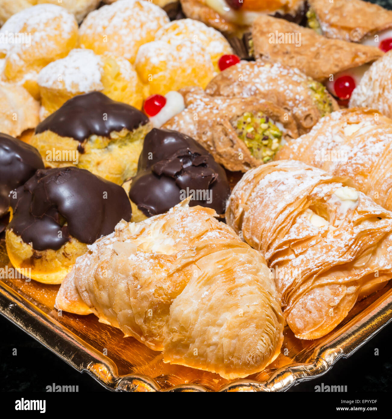 colorful pastries with fruits, cream and chocolate, the real Italian ...