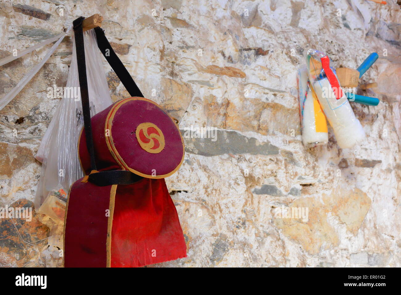 Buddhist monk.s cap hanging on the wall of kitchen in hut halfway up to ...