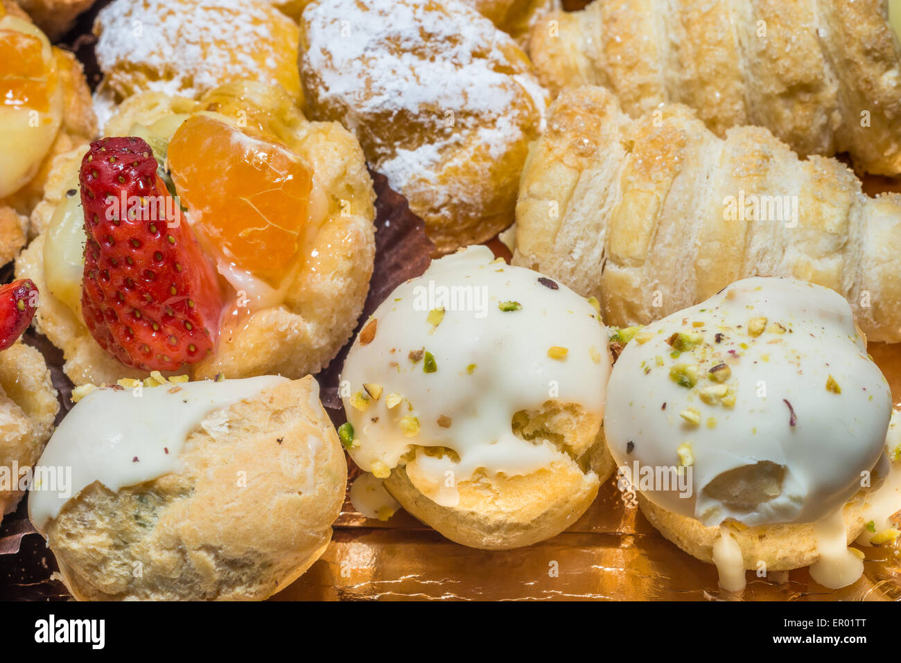colorful pastries with fruits, cream and chocolate, the real Italian ...