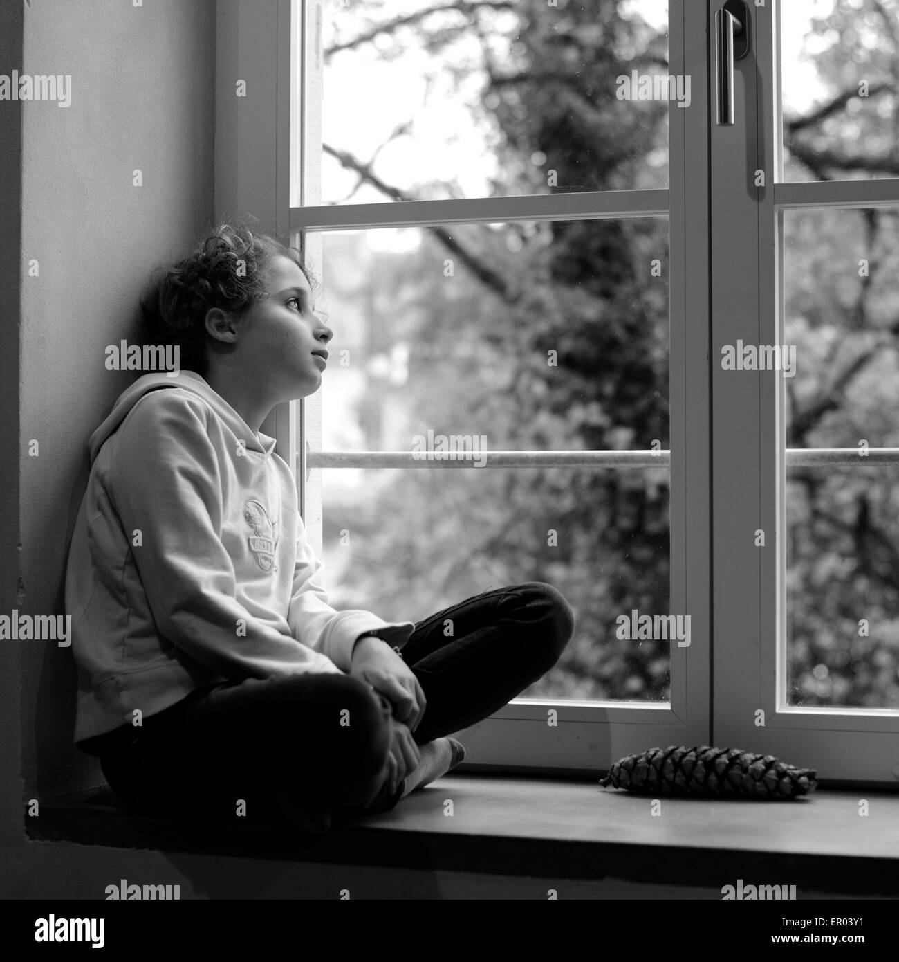 Sad girl window Black and White Stock Photos & Images - Alamy