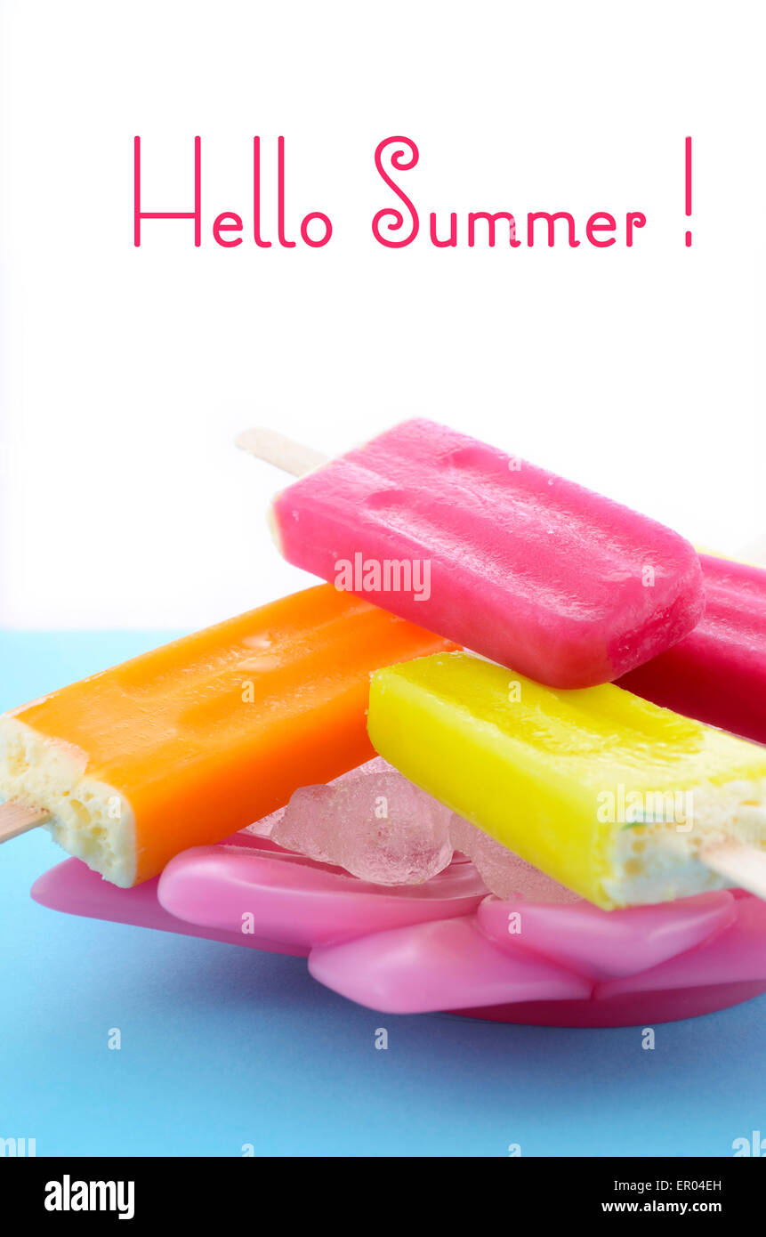 Summer is Here concept with bright color ice pop, ice creams on blue ...