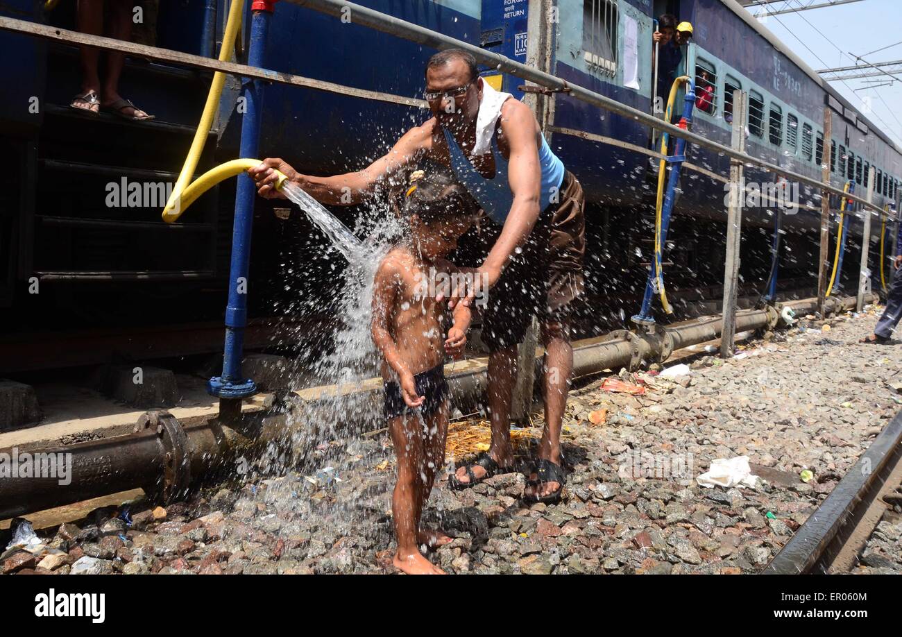 Allahabad, India. 24th May, 2015. An Indian commuter uses the train ...