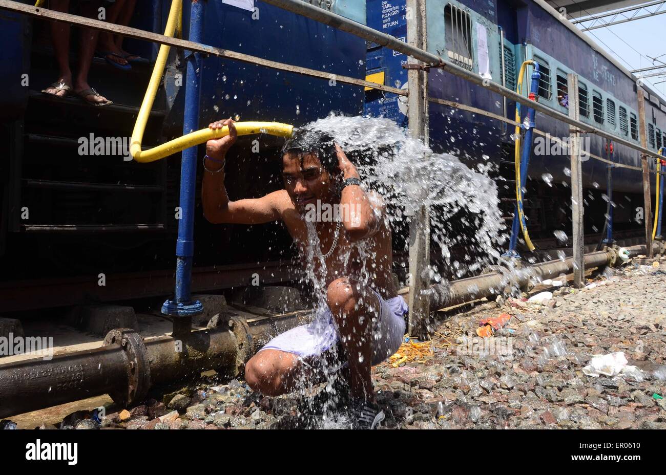 Allahabad, India. 24th May, 2015. An Indian commuter uses the train ...