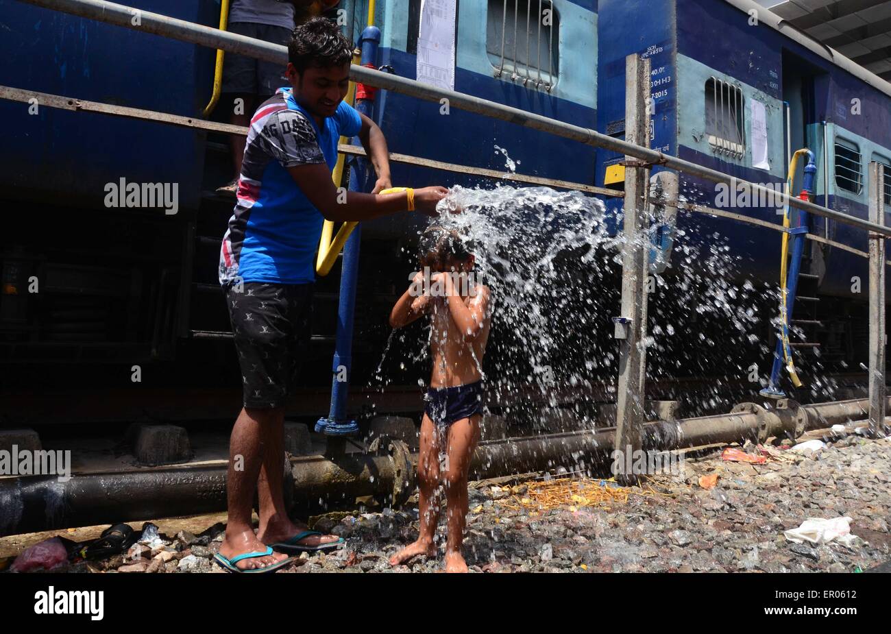 Allahabad, India. 24th May, 2015. An Indian commuter uses the train ...