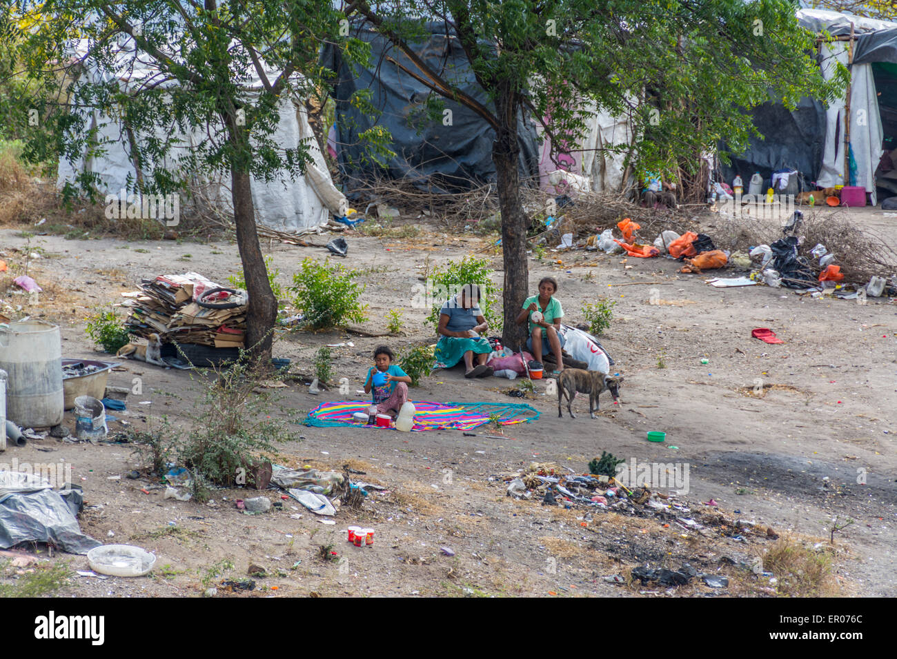 Storage huts for recyclable items collected by poor people at a garbage ...