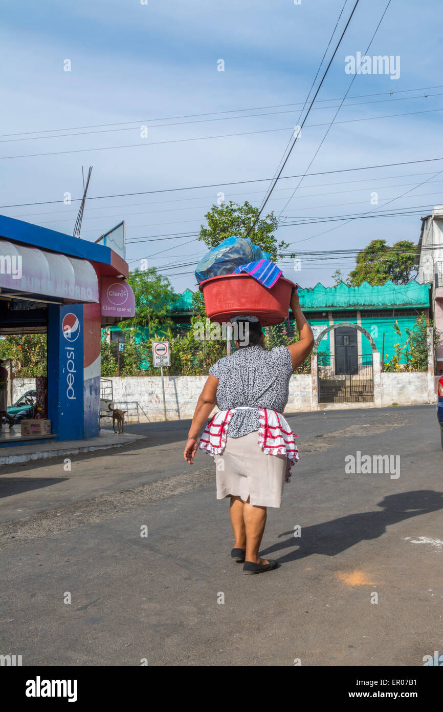 Guatemalan woman carrying items in a basket on top of her head Stock ...
