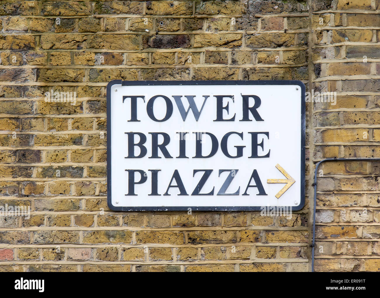 Tower Bridge piazza sign in London Stock Photo - Alamy