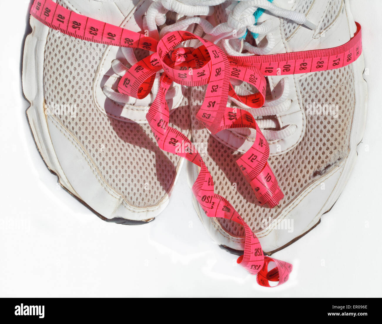 shabby elder training shoes with measuring tape like a gift Stock Photo ...