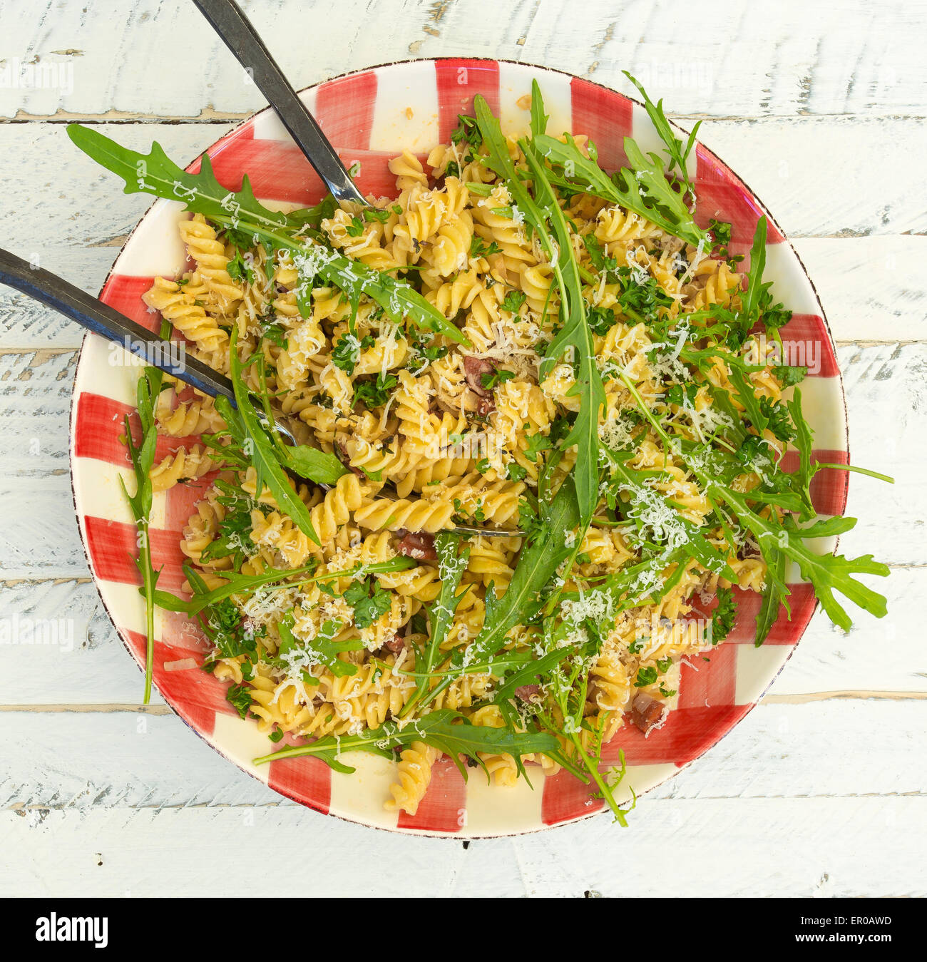 Italian pasta fusilli with fresh garlic and rocket leaves, spanish ...