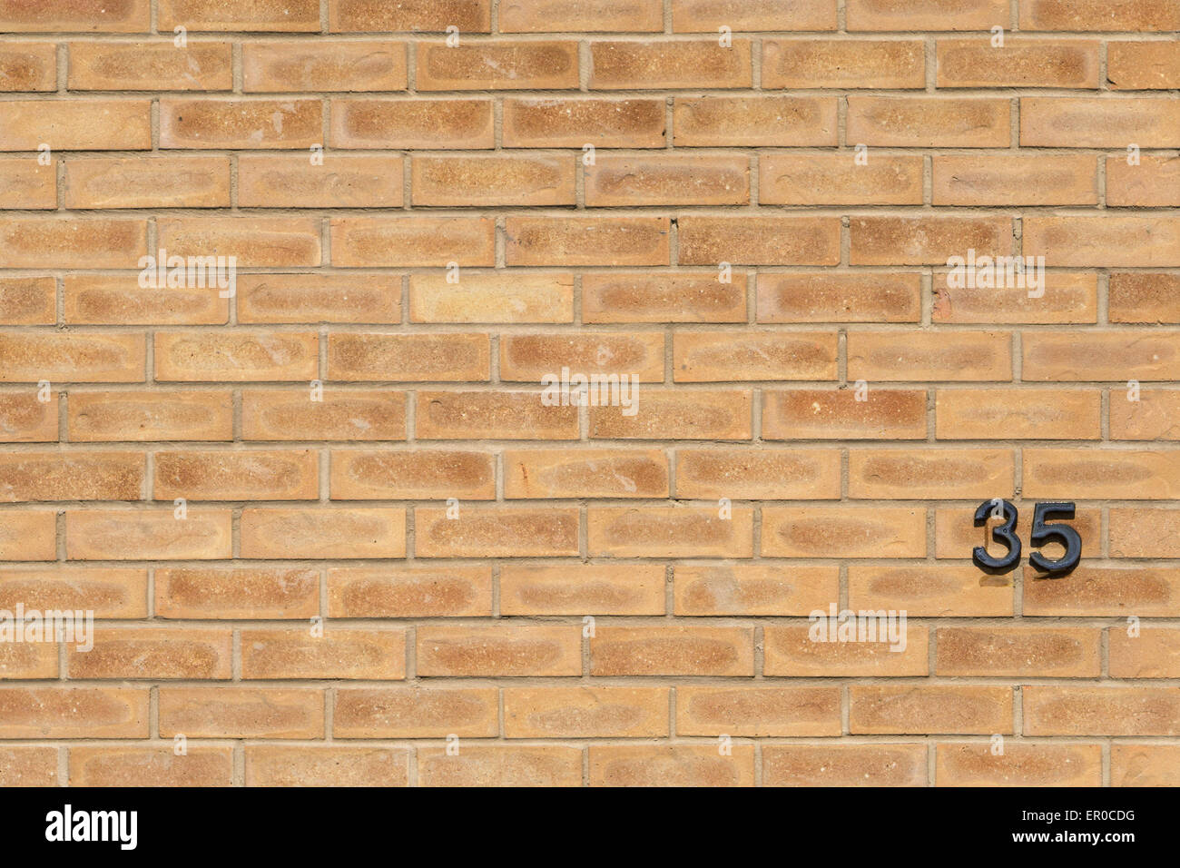 Number 35 thirty five sign on a brick wall for background Stock Photo ...