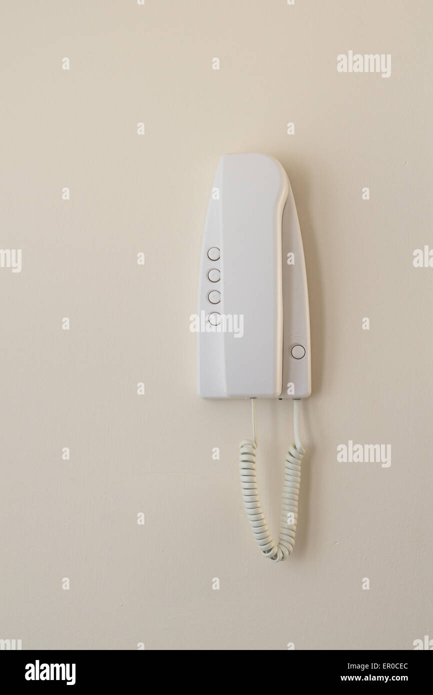 Modern intercom with receiver closeup Stock Photo - Alamy