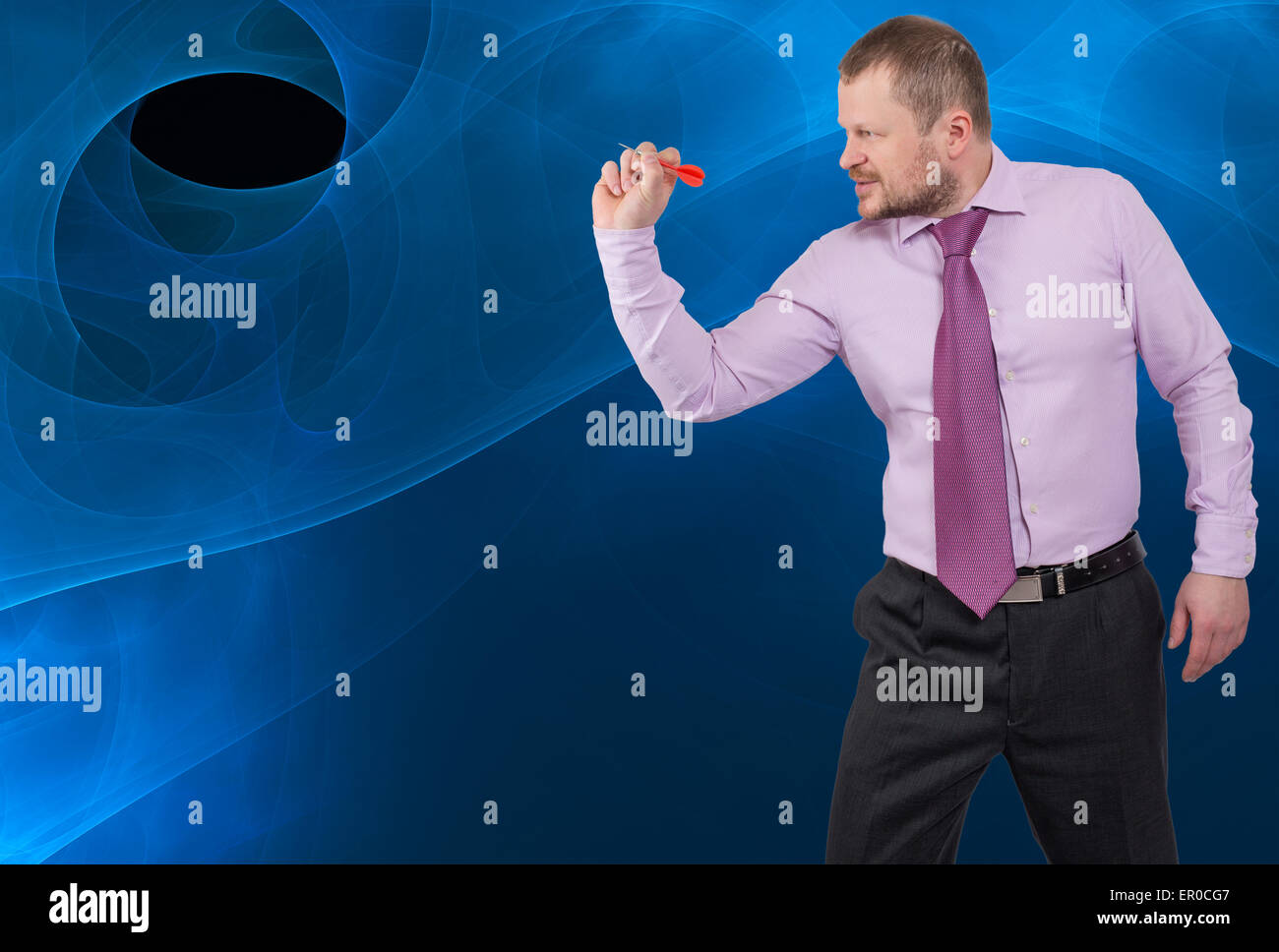 Businessman aiming by dart on blue abstract background Stock Photo - Alamy