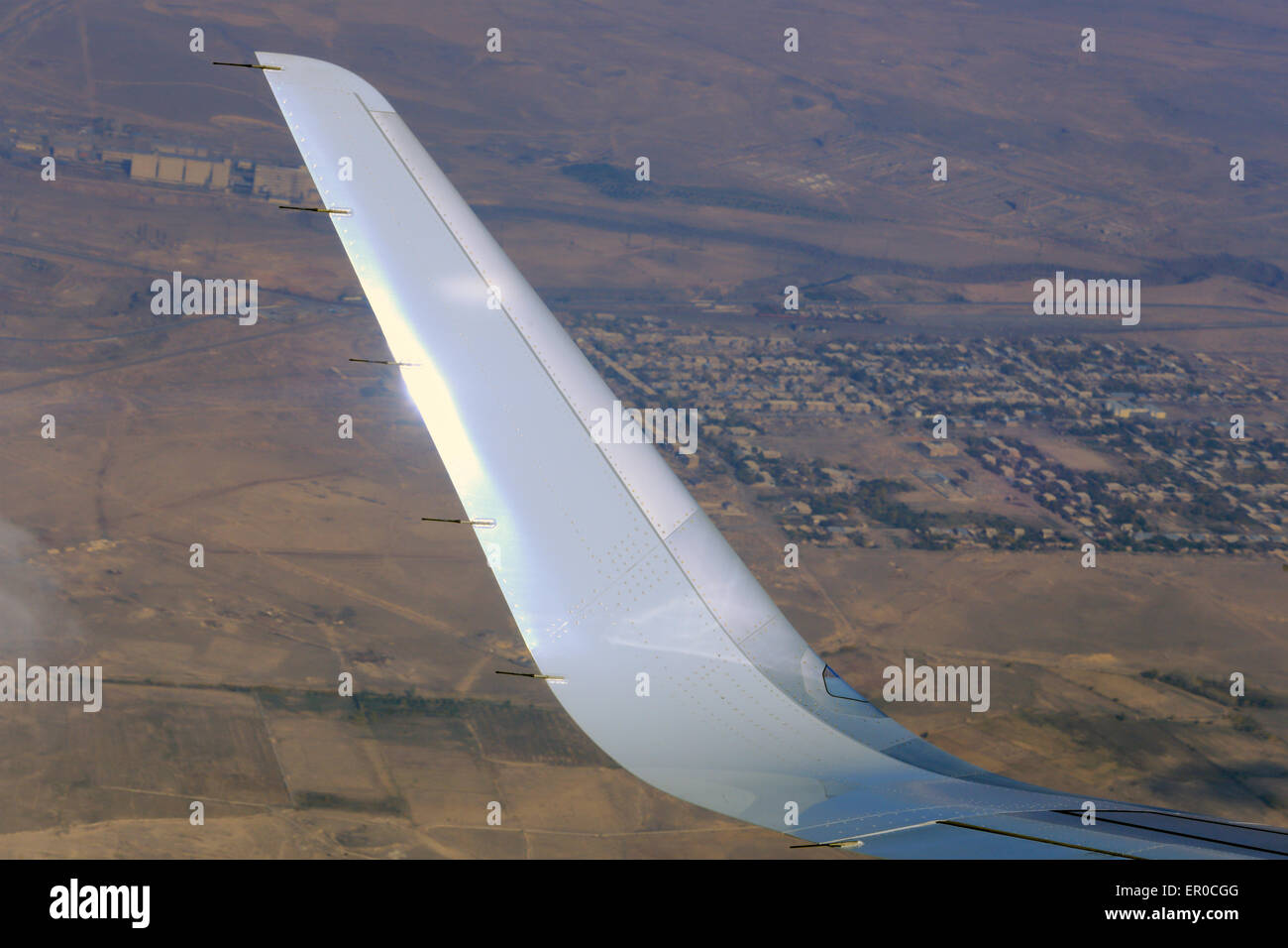 Detail of airplane wing in flight surface transport Stock Photo - Alamy