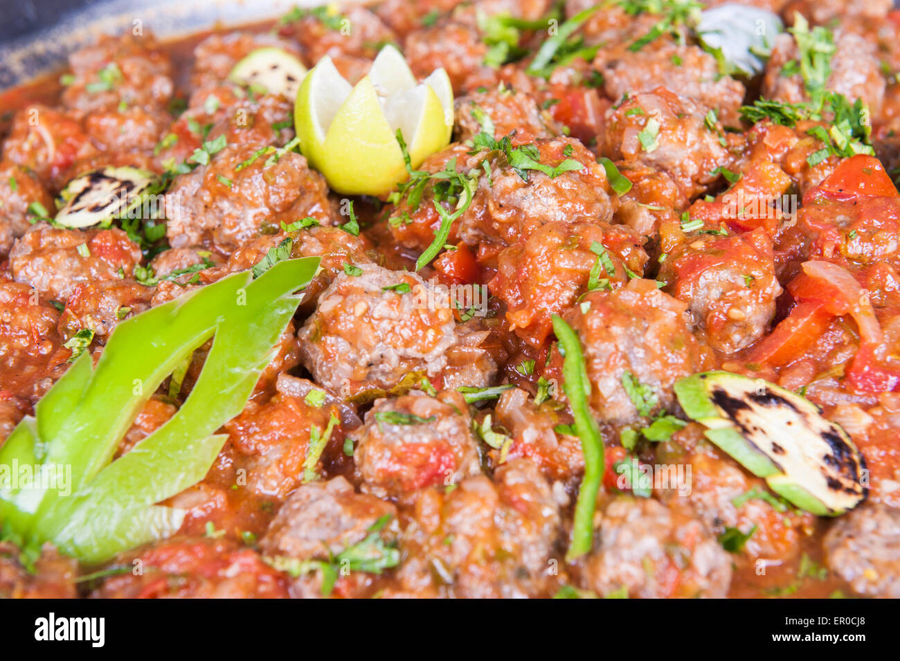 Egyptian beef meatballs in tomato sauce on display at a restaurant ...