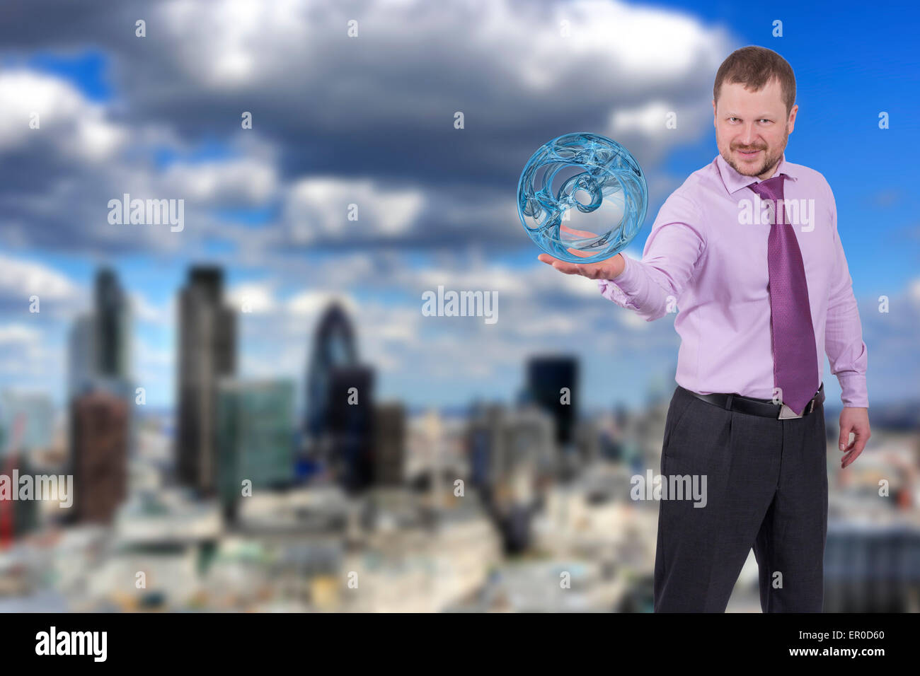 Businessman holding his right hand out palm up with sphere with modern ...