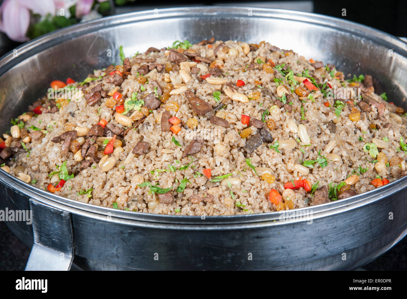 Oriental rice dish with peanuts on display at a hotel restaurant buffet ...