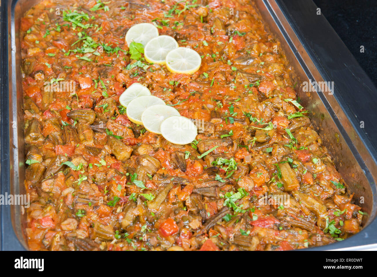 Closeup detail of okra and tomato egyptian ragout on display at a ...