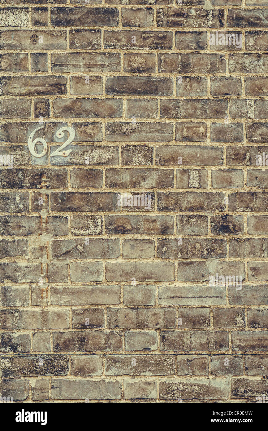 House number 62 sixty two weathered wall closeup Stock Photo - Alamy