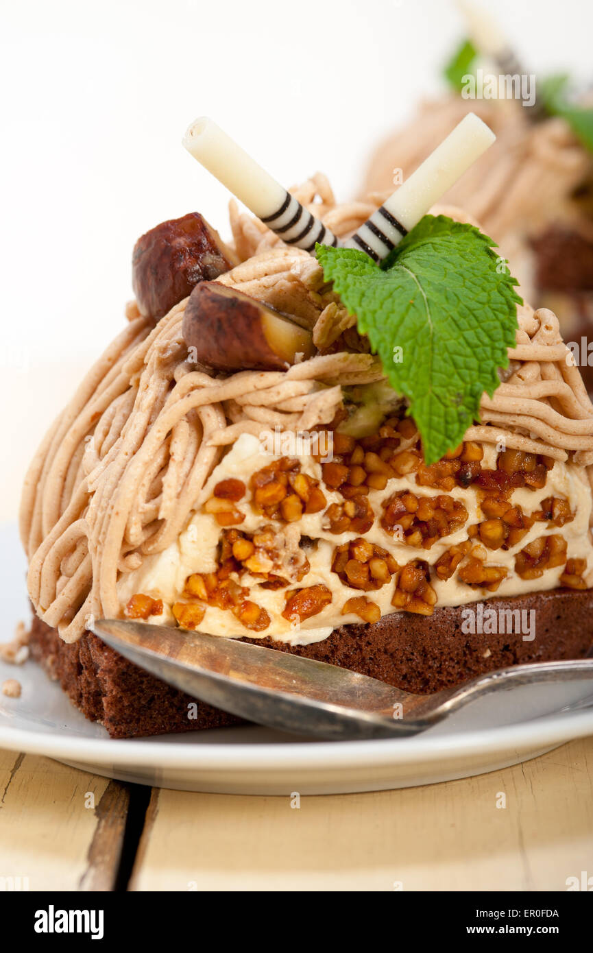 fresh baked chestnut cream cake dessert over rustic white wood table ...
