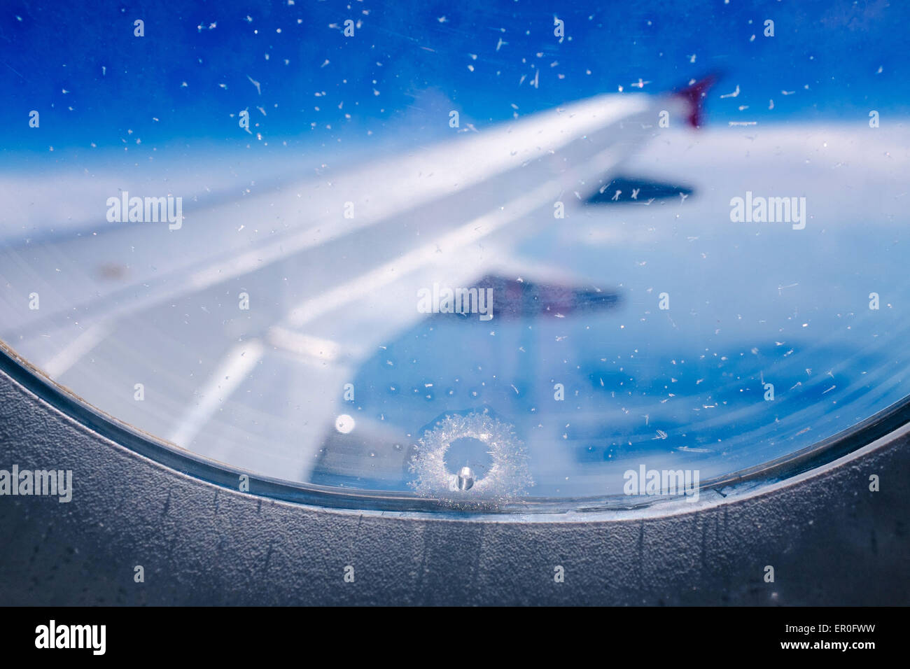 Hole in airplane window hi-res stock photography and images - Alamy