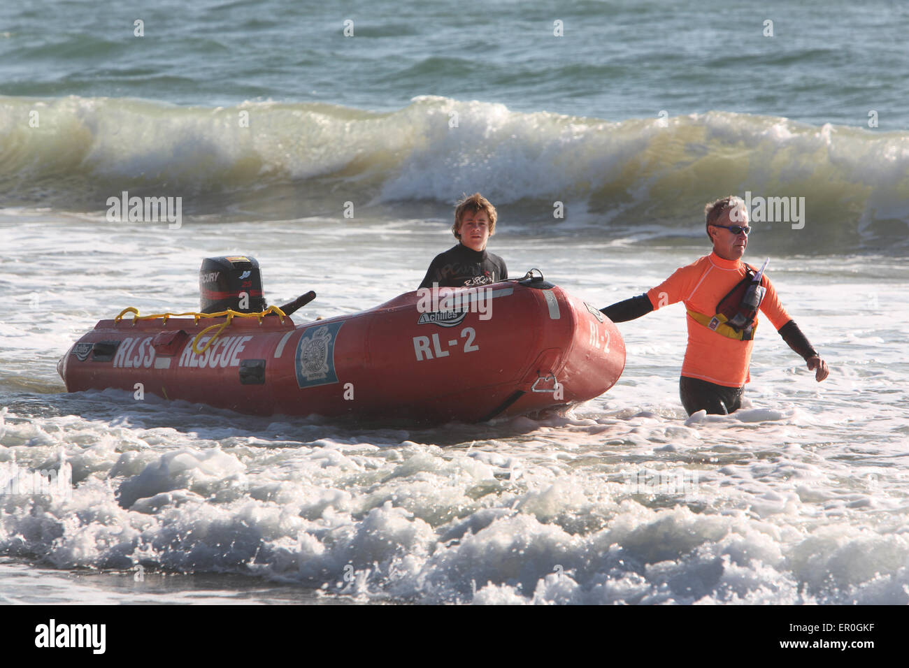 Surf lifesavers with inflatable rescue boat (IRB) on the surf coast in ...