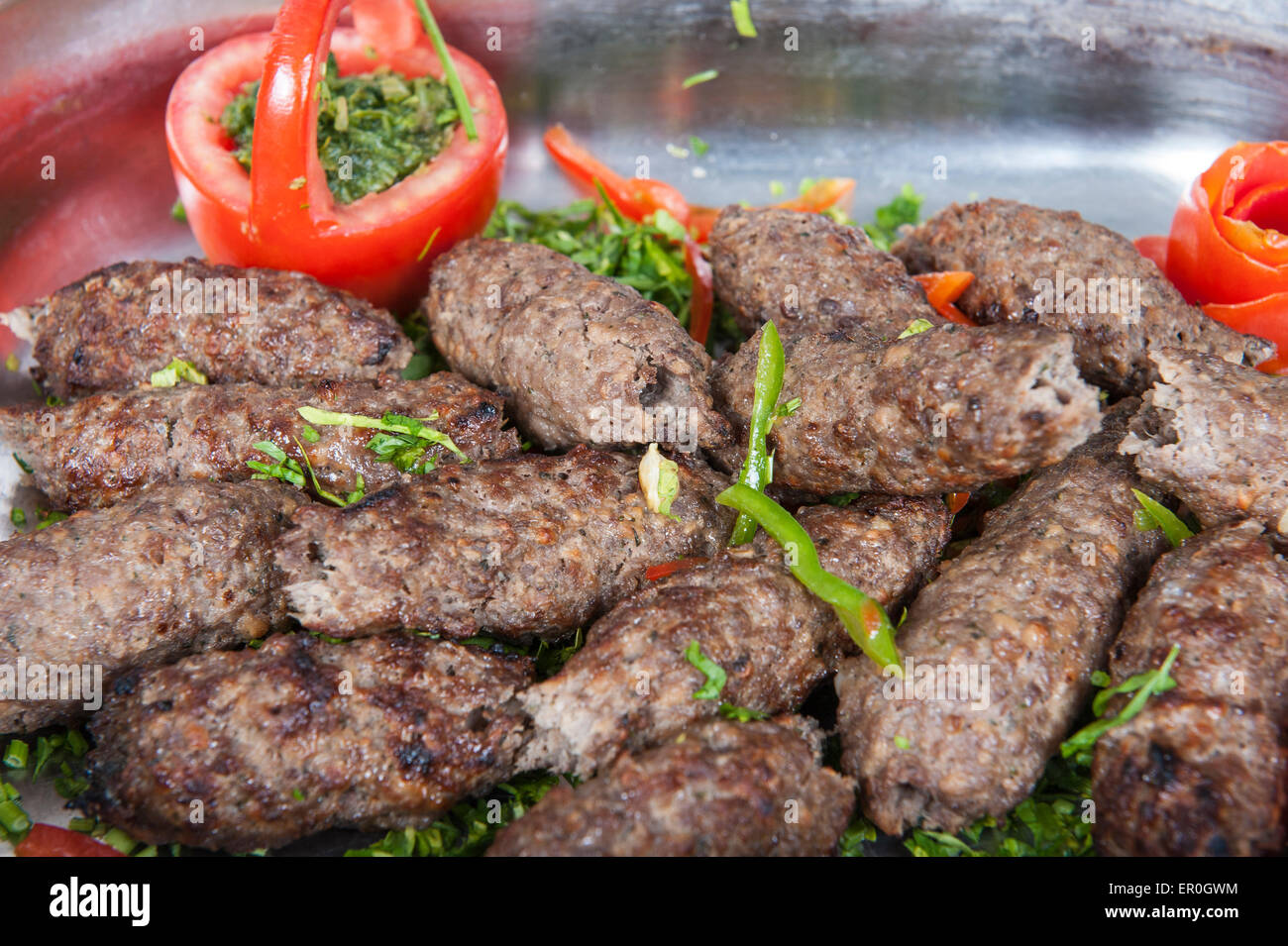 Closeup detail of grilled lamb kofta meat on display at an oriental ...