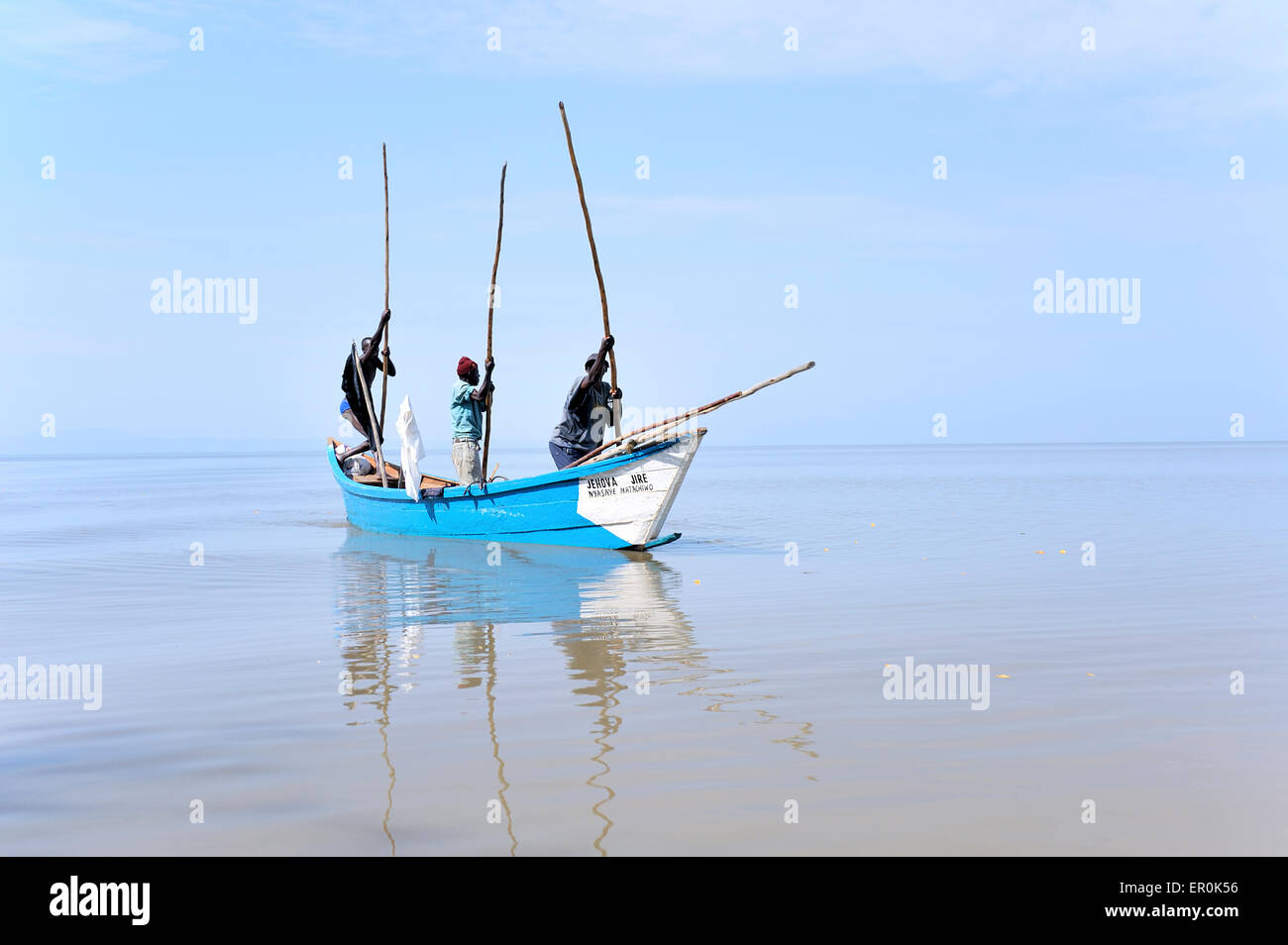 Fisherman pushing fishing boat hi-res stock photography and images - Alamy