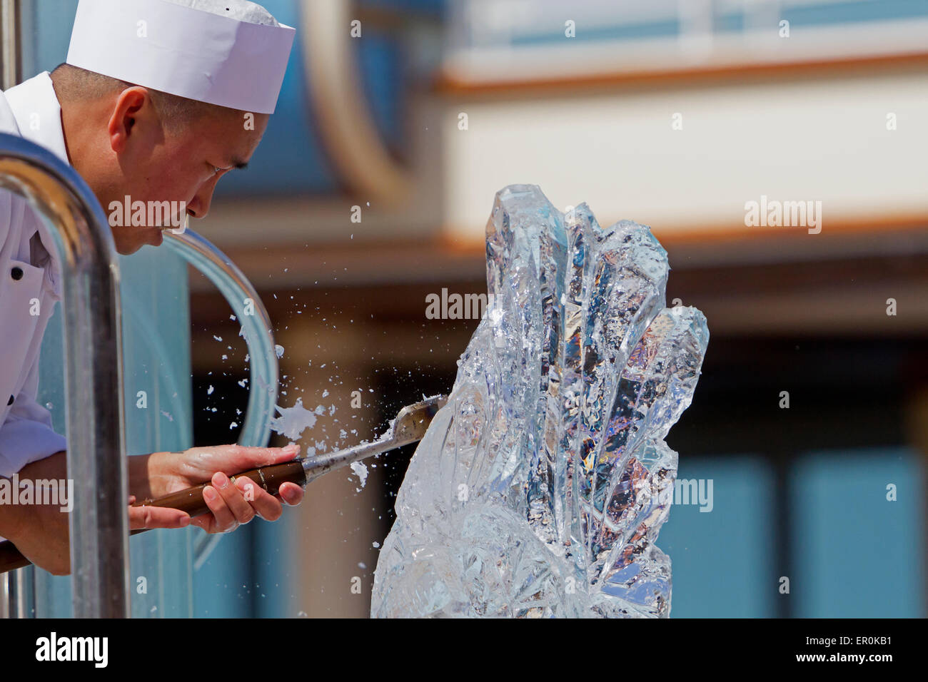 A chef demonstrates Ice carving on board the Azura Stock Photo - Alamy