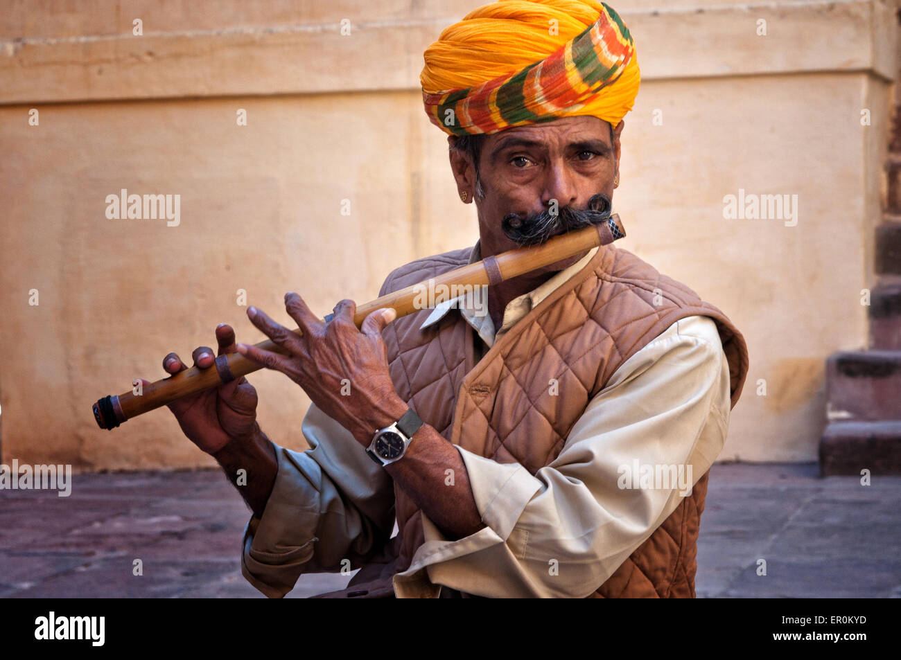 Indian man playing the flute hi-res stock photography and images - Alamy