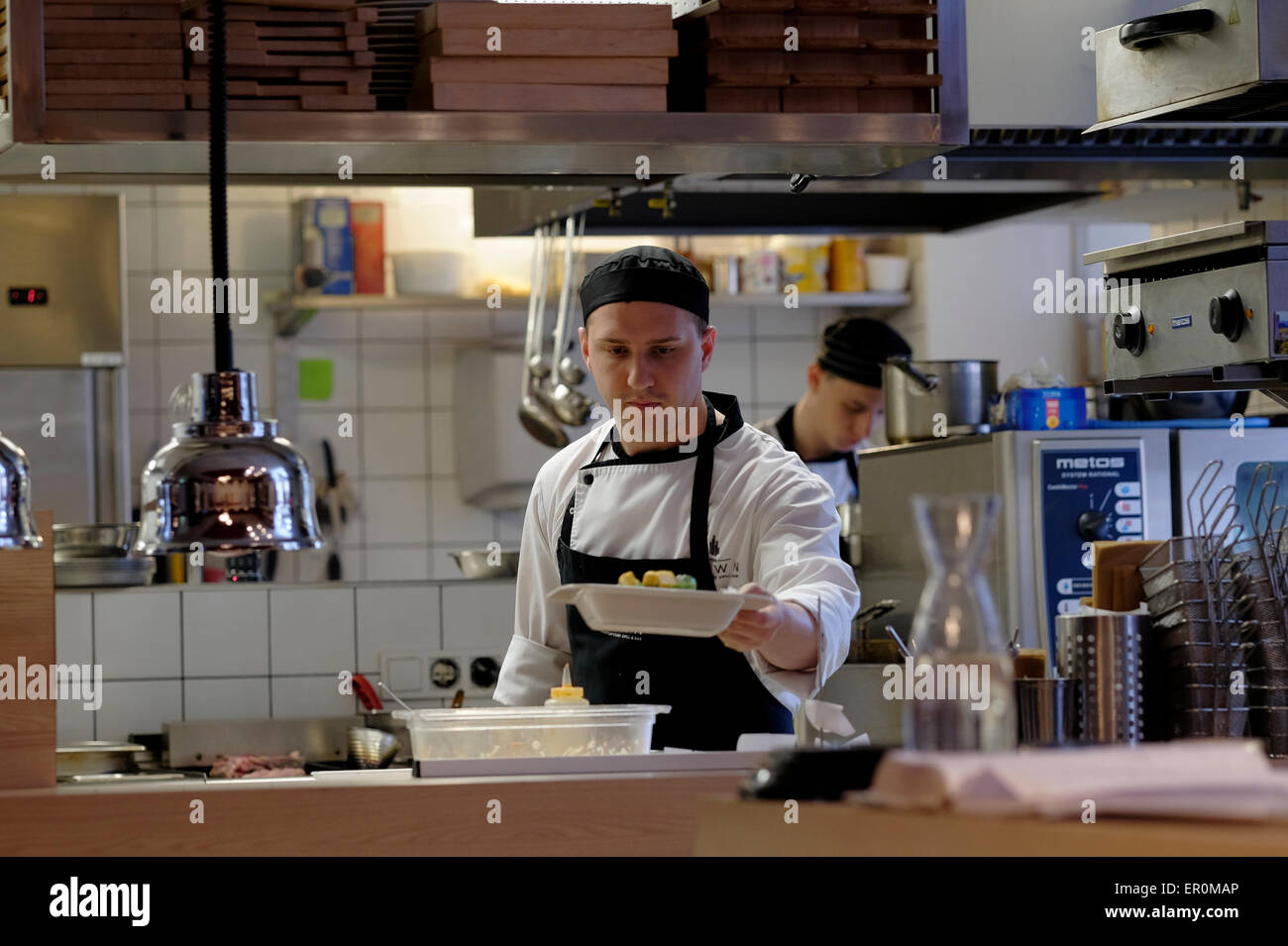 Kitchen workers at The Town Restaurant in the city of Vilnius, the ...