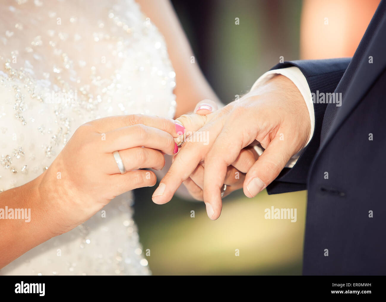 Bride and groom with wedding rings Stock Photo - Alamy