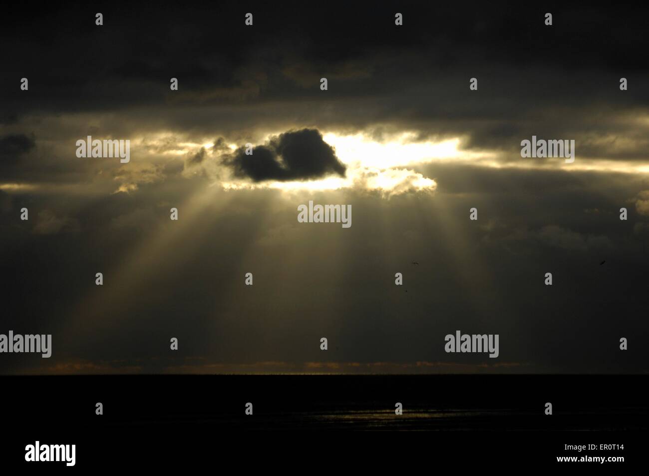Sun through stormy clouds hi-res stock photography and images - Alamy