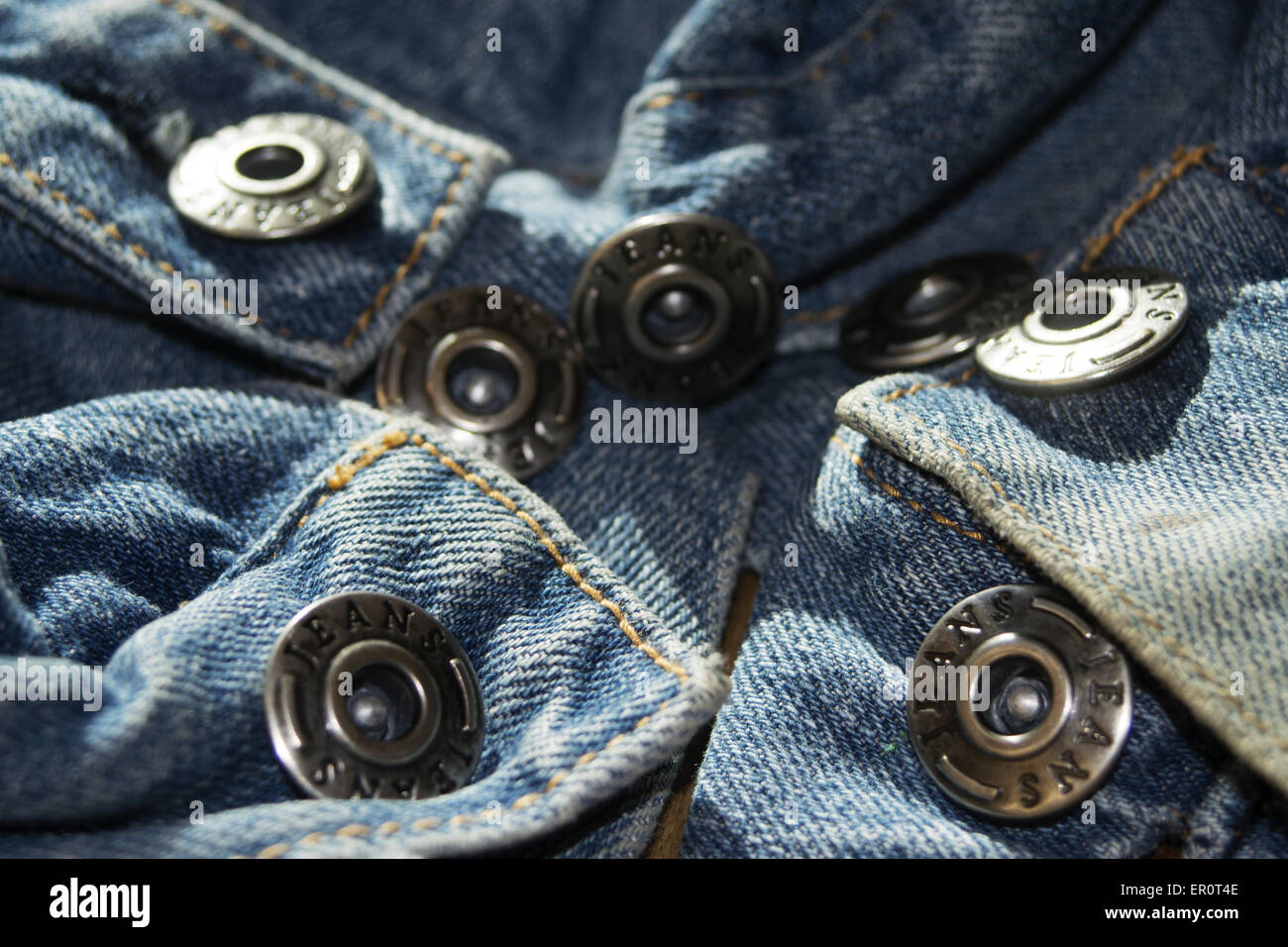 metallic button of a jacket jeans Stock Photo - Alamy