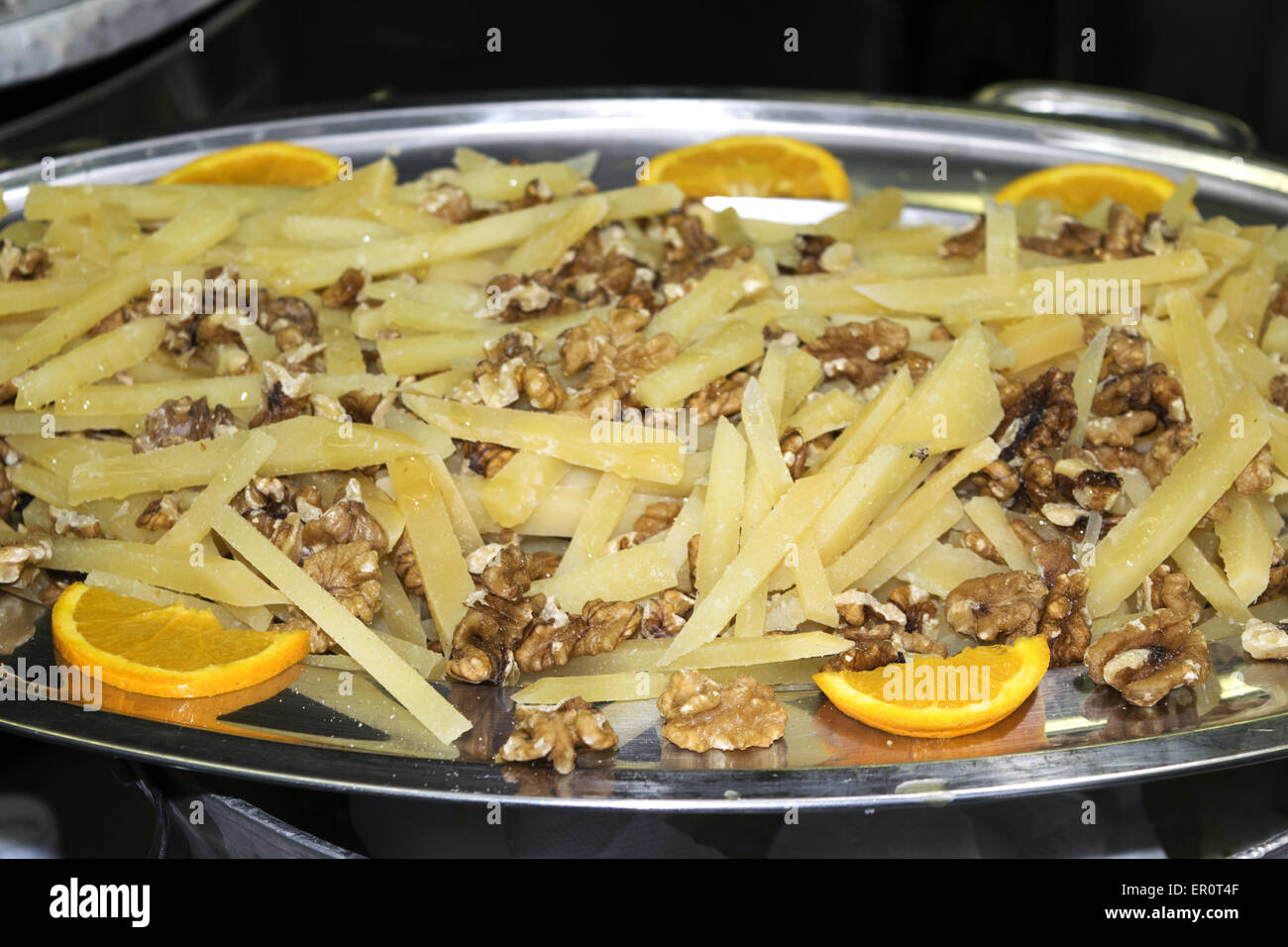 appetizer of sticks of parmesan cheese and kernels of walnuts Stock ...