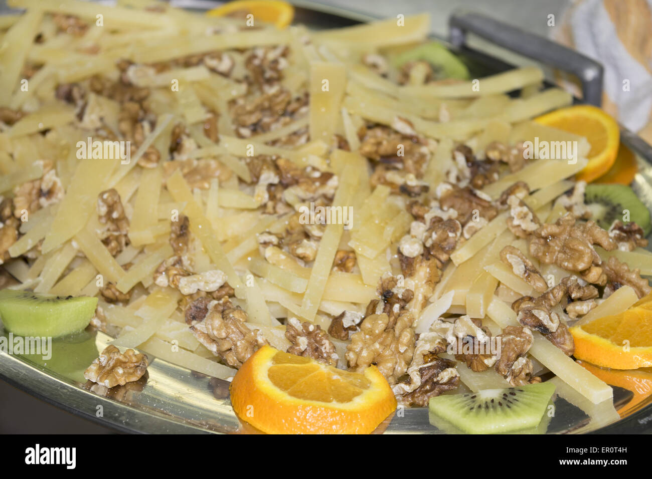 appetizer of sticks of parmesan cheese and kernels of walnuts Stock ...