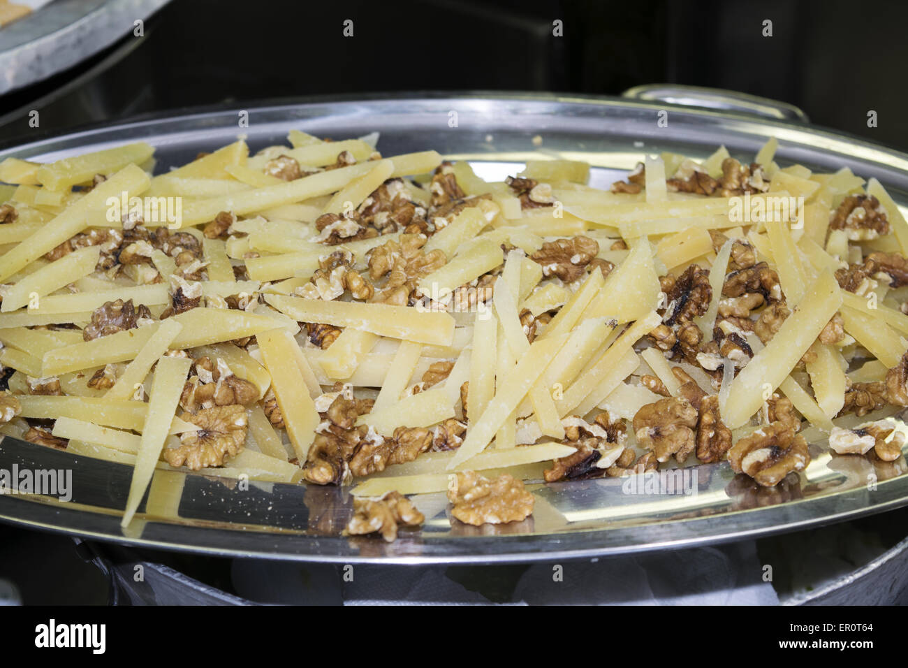 appetizer of sticks of parmesan cheese and kernels of walnuts Stock ...