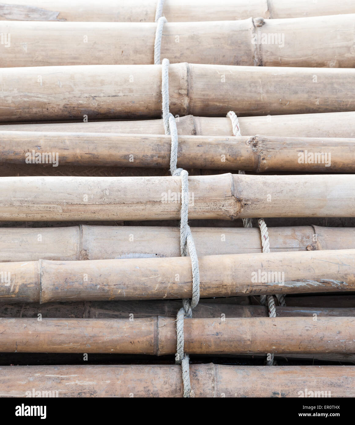 Bamboo raft with the old rope is floating in the lake Stock Photo - Alamy