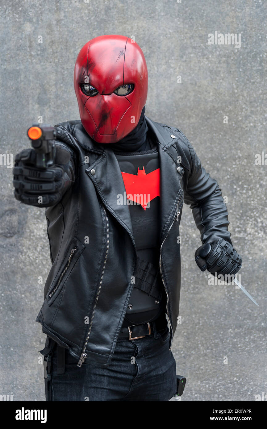 London, UK. 24 May 2015. A man dressed as Red Hood poses, as fans of ...