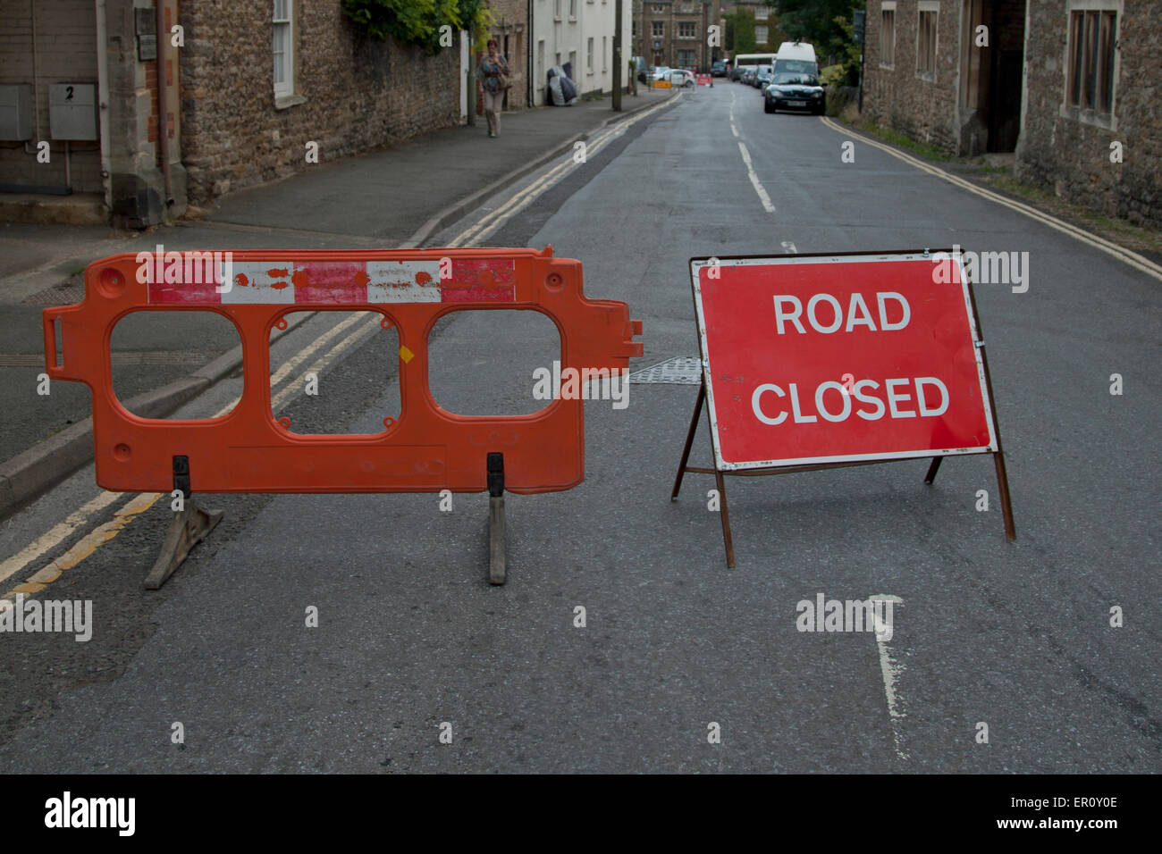 'Road Closed' sign and barrier stopping traffic on an English road ...