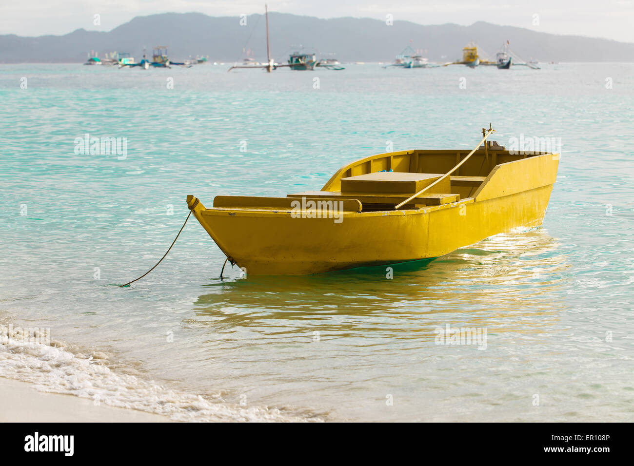 Yellow boat on tropical blue sea, Philippines Stock Photo - Alamy